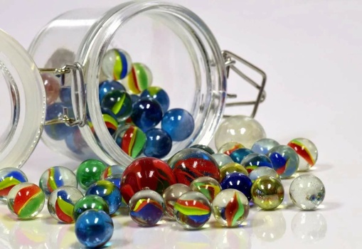 Solve Jar full of marbles jigsaw puzzle online with 77 pieces