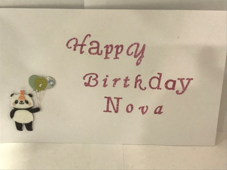 Solve Nova first birthday envelope jigsaw puzzle online with 12 pieces