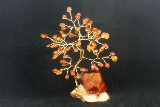 Solve Amber gem tree on a crystal base jigsaw puzzle online with 54 pieces